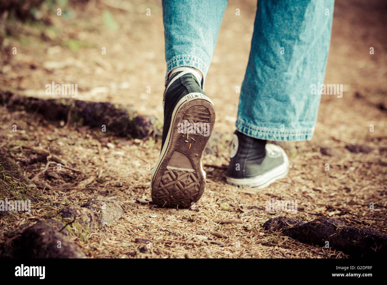 Woman Walking Along Hiking Trail, Rear View of Feet Stock Photo - Alamy