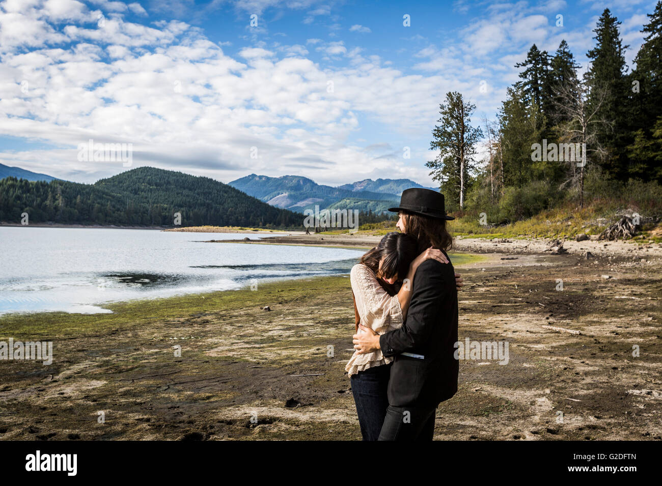 Bohemian Couple Embracing with Scenic Landscape in Background, Merrill ...