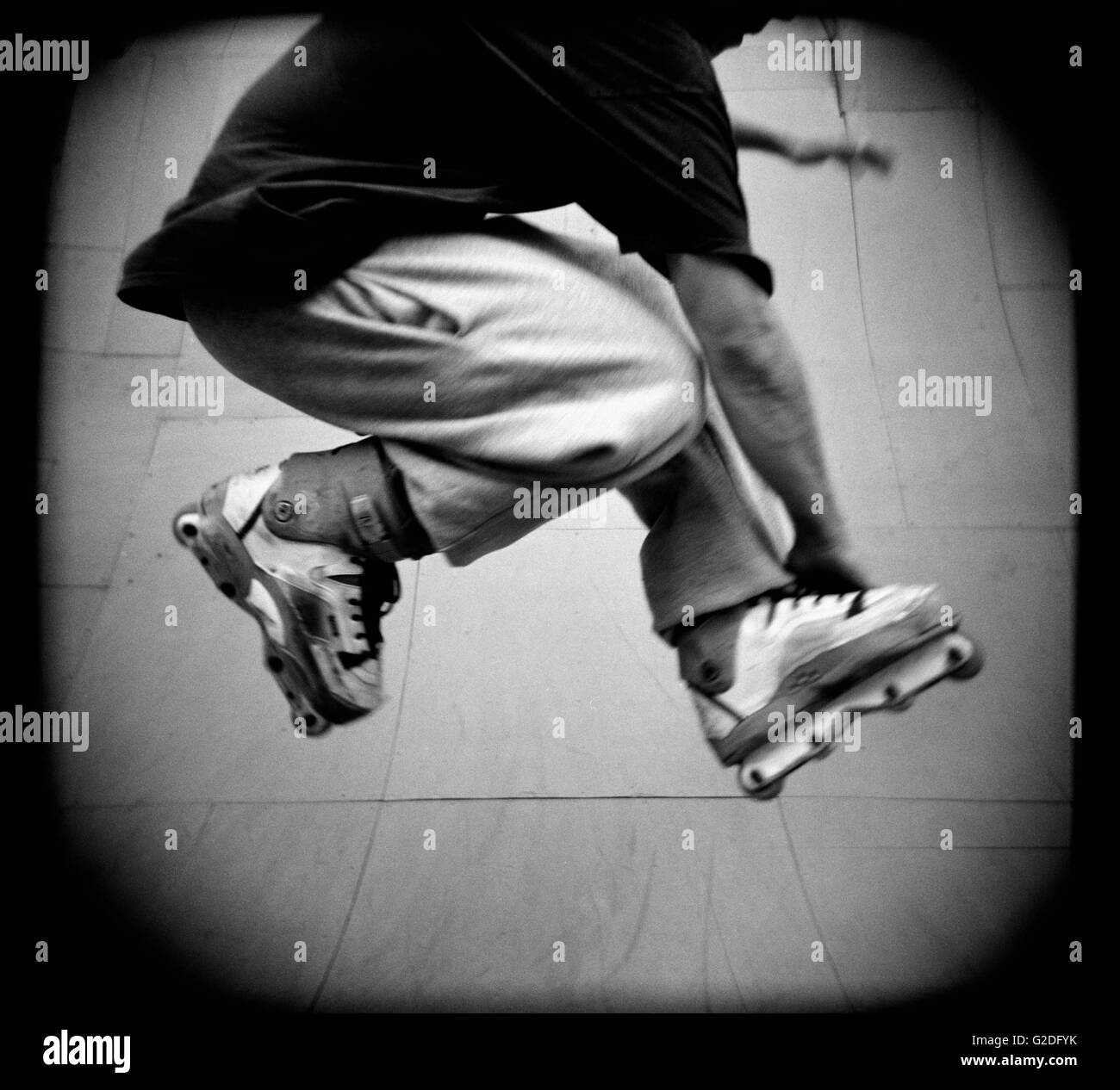 Rollerblader Doing Trick in Mid-Air Stock Photo - Alamy