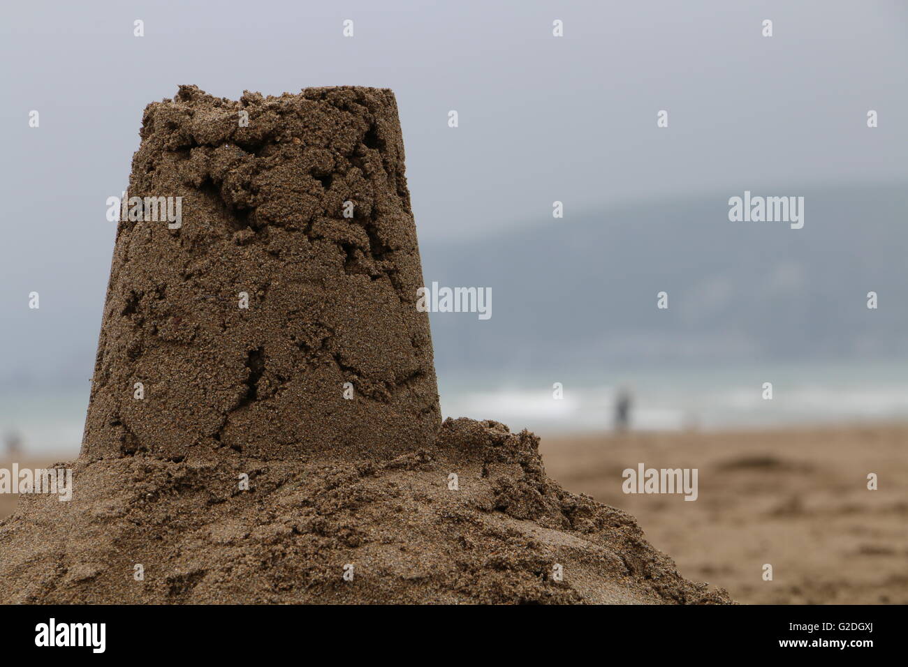 Crude sandcastle on a Devon beach on a grey day Stock Photo - Alamy