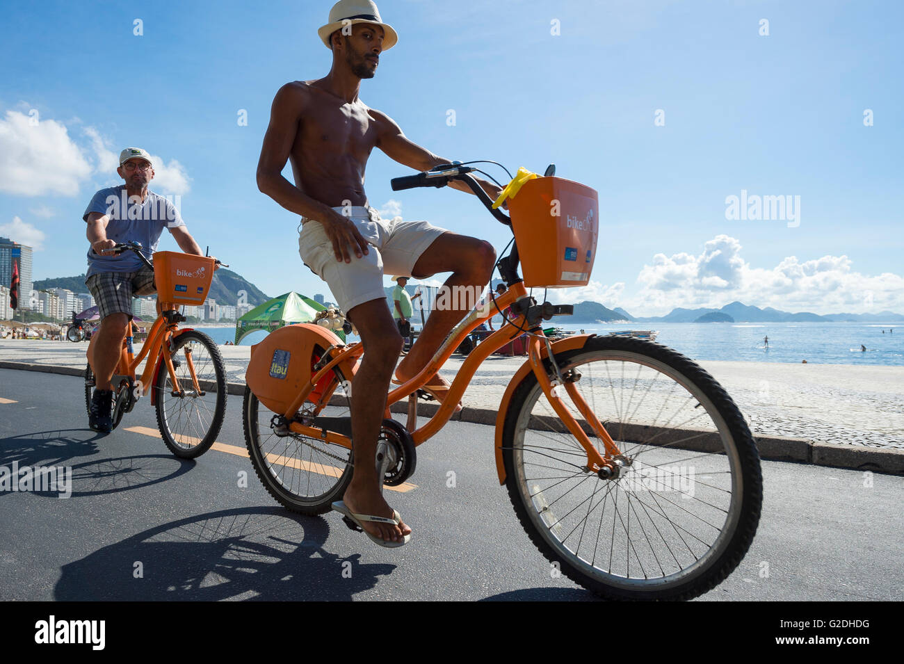 RIO DE JANEIRO - MARCH 20, 2016: Brazilians ride orange bike-share ...