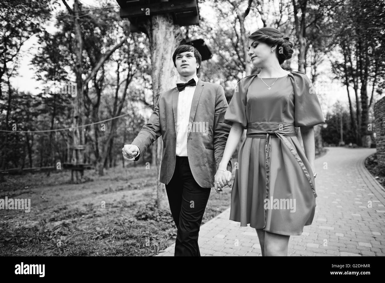 Happy couple walking in love at green park. Stylish man at velvet ...