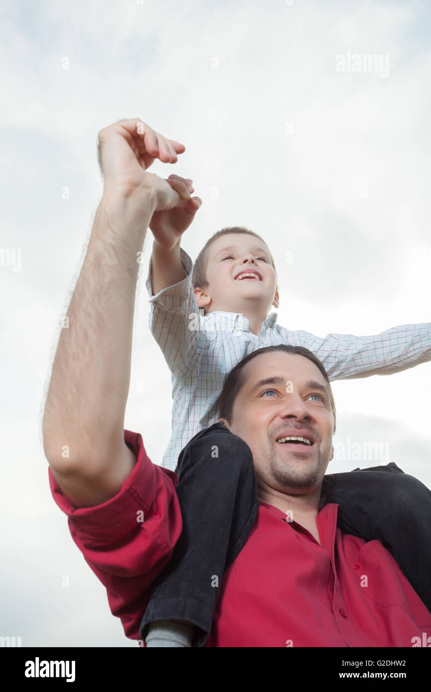 Child on shoulders hi-res stock photography and images - Alamy