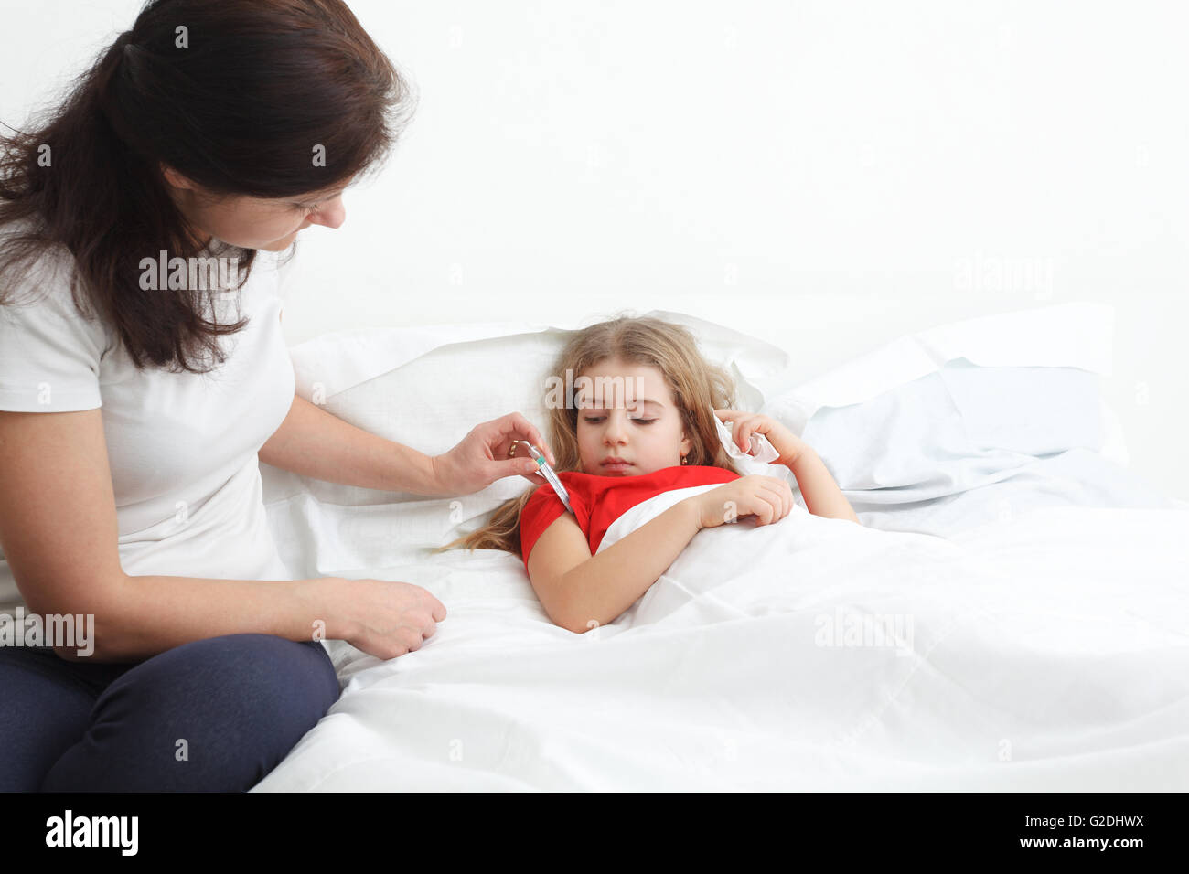 mother measuring fever of her sick child Stock Photo - Alamy