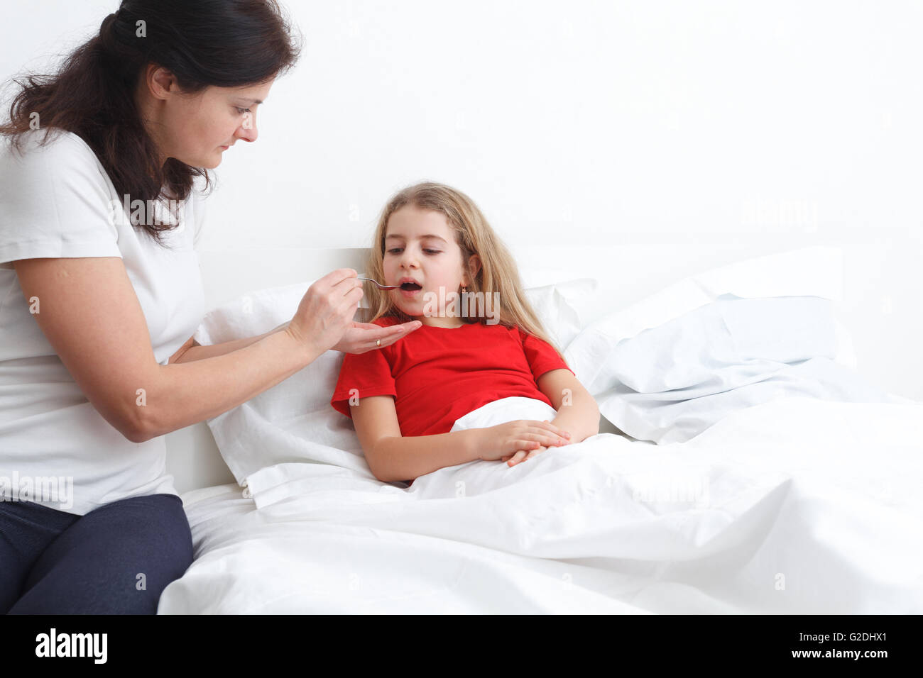 Mother taking care of sick daughter hi-res stock photography and images ...