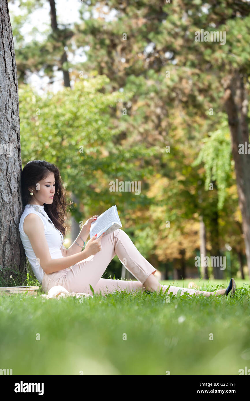 Pose Leaning Against Tree