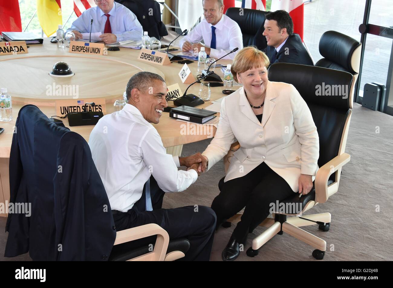 U.S. President Barack Obama shakes hands with German Chancellor Angela ...