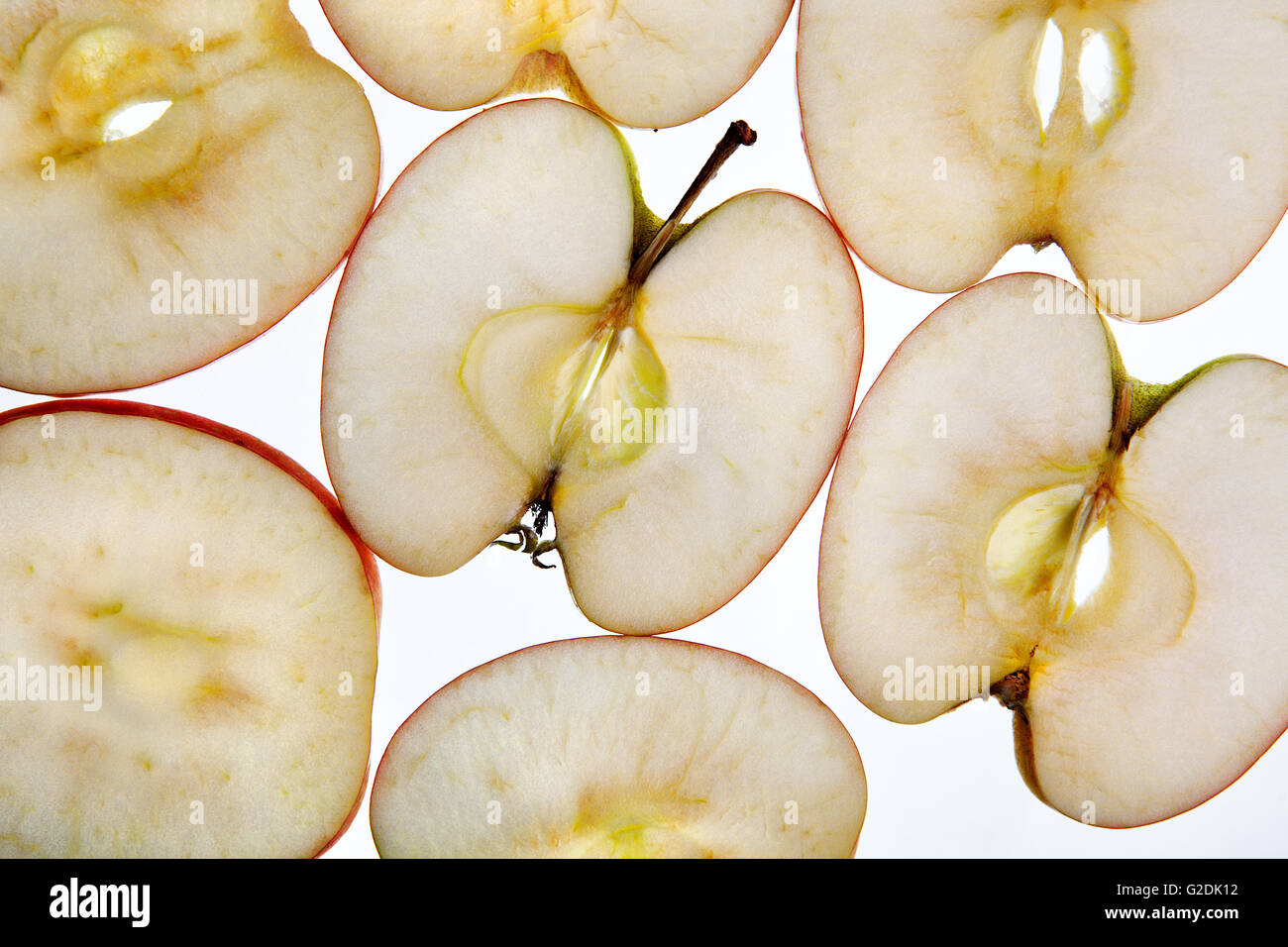 Fresh ripe Apples cut in thin slices on white background studio shot ...