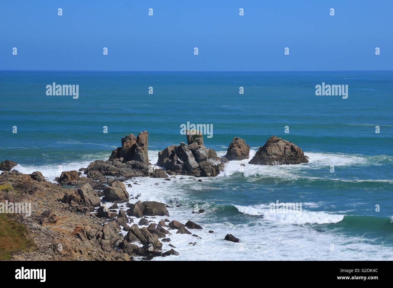 Scene at the west coast of New Zealand. Big rocks in the ocean Stock ...