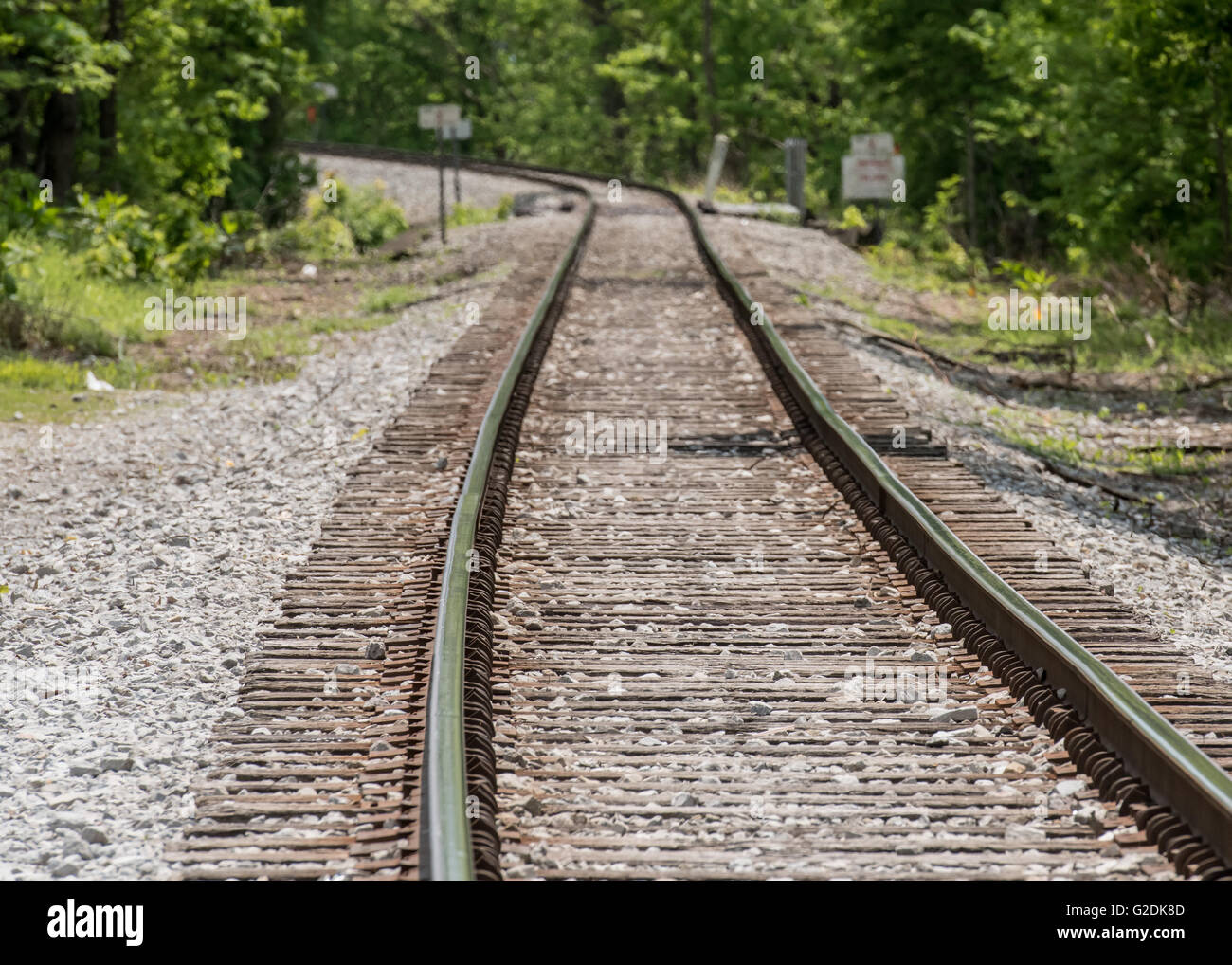 Train Track Curves to the Left on its way out of a small town Stock ...
