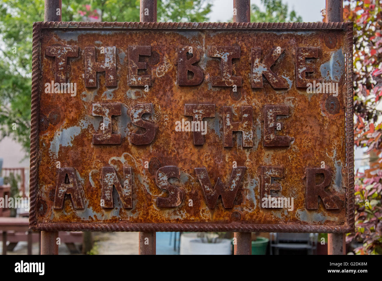 The Bike is the Answer Rusted Sign on rusted fence Stock Photo - Alamy