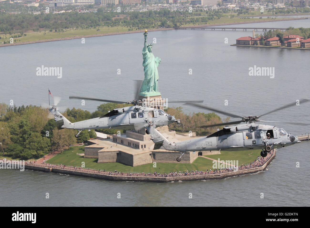 U.S Navy Sea Hawk helicopters fly a formation flight past the Statue of ...