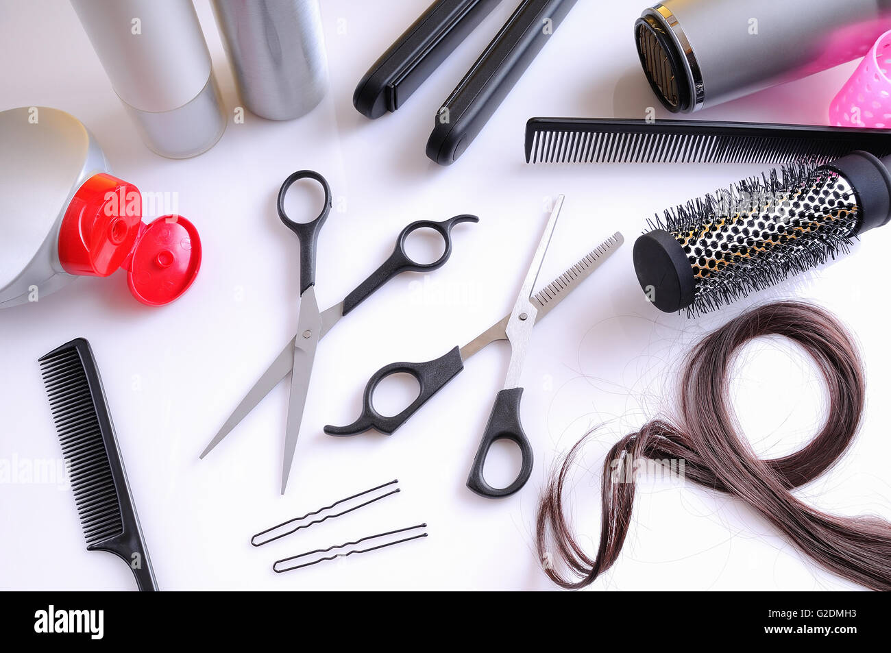 Set hairdressing articles exposed on a white table top view isolated ...