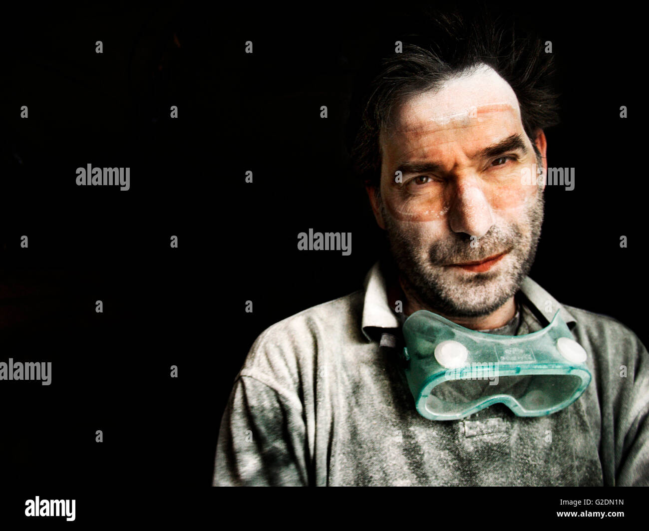 Man with Goggles Covered in Dust Stock Photo - Alamy