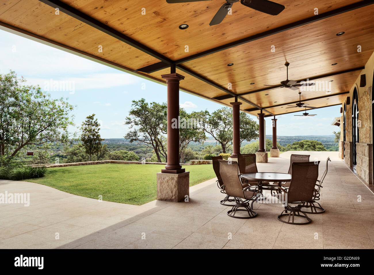 Long Covered Portico with Wood Ceiling and Celling Fans and View of ...