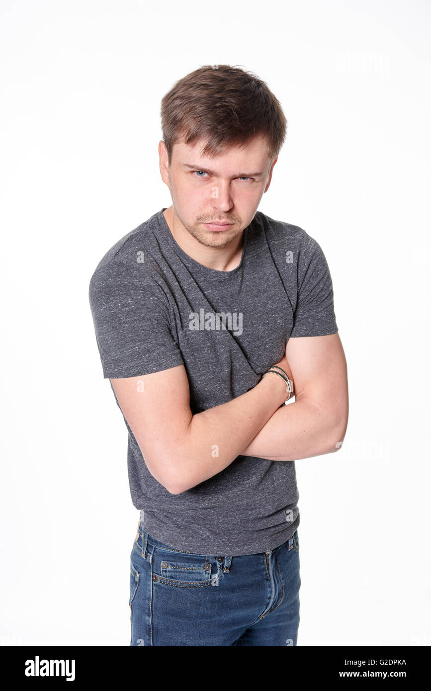 Aggressive young man arms folded hi-res stock photography and images ...