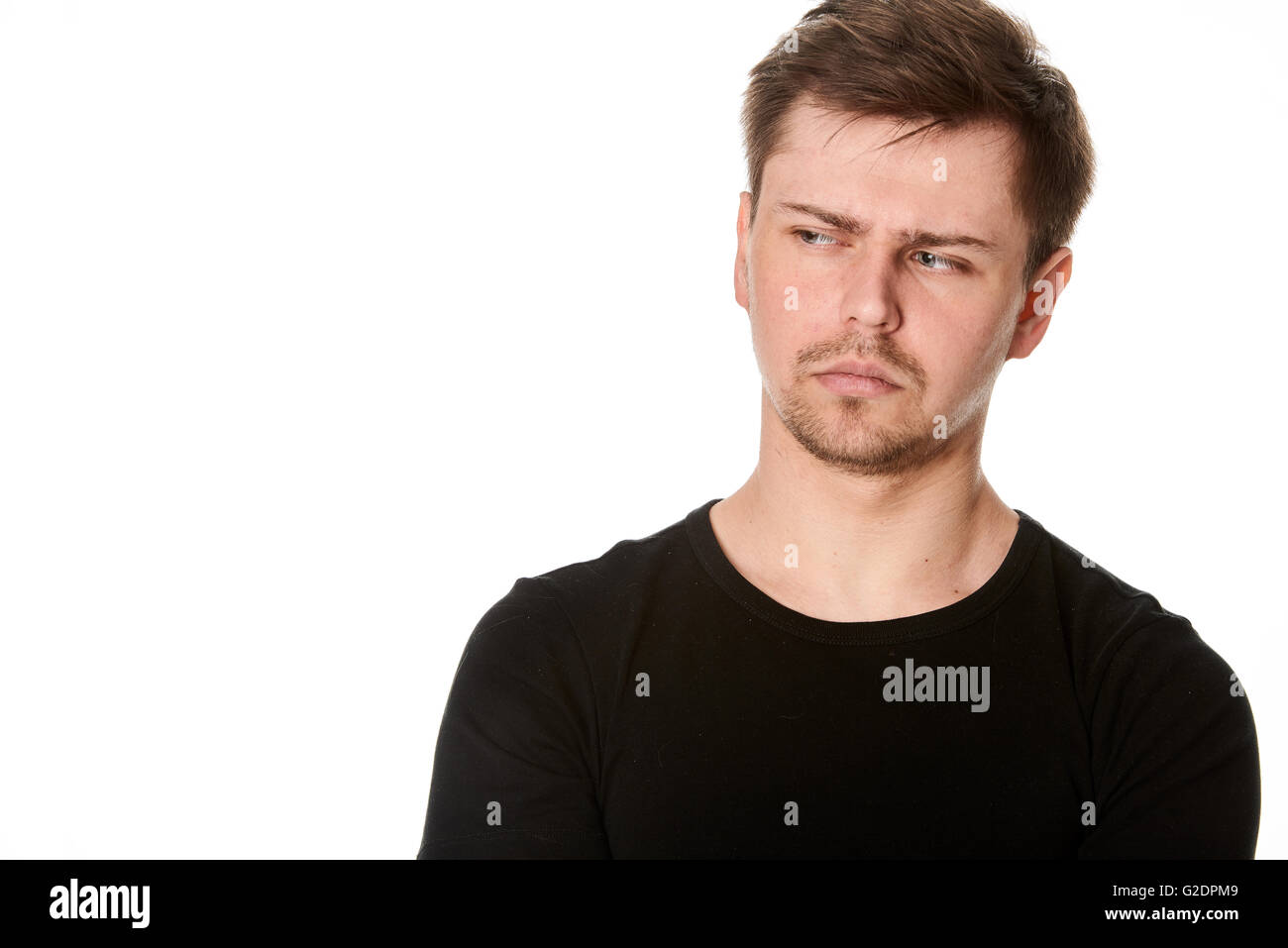 Suspicious young man, isolated on white, with space for text Stock ...