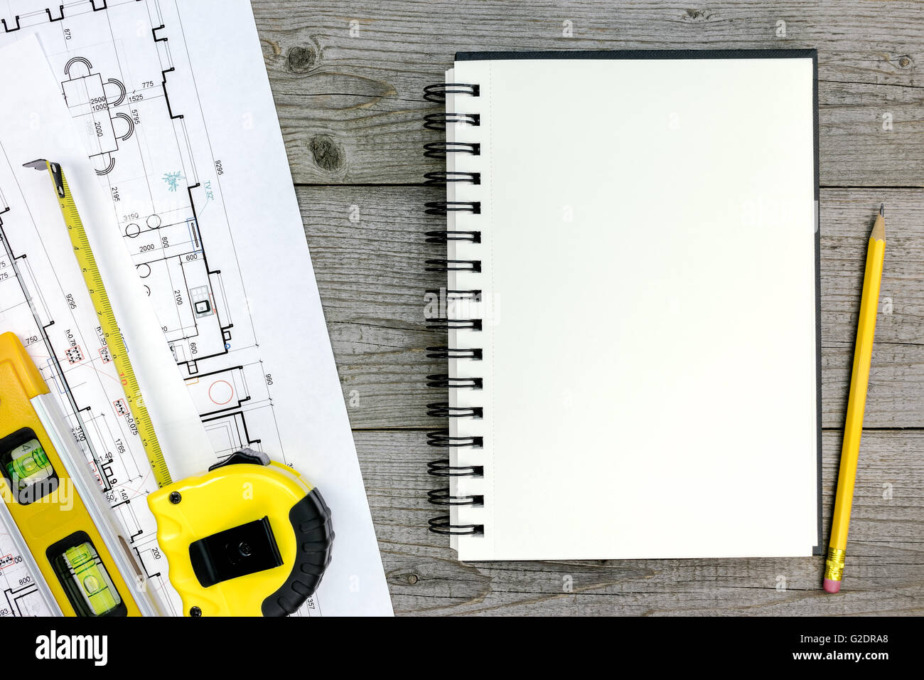 architect workspace with blueprint, tools, notepad and pencil on gray ...