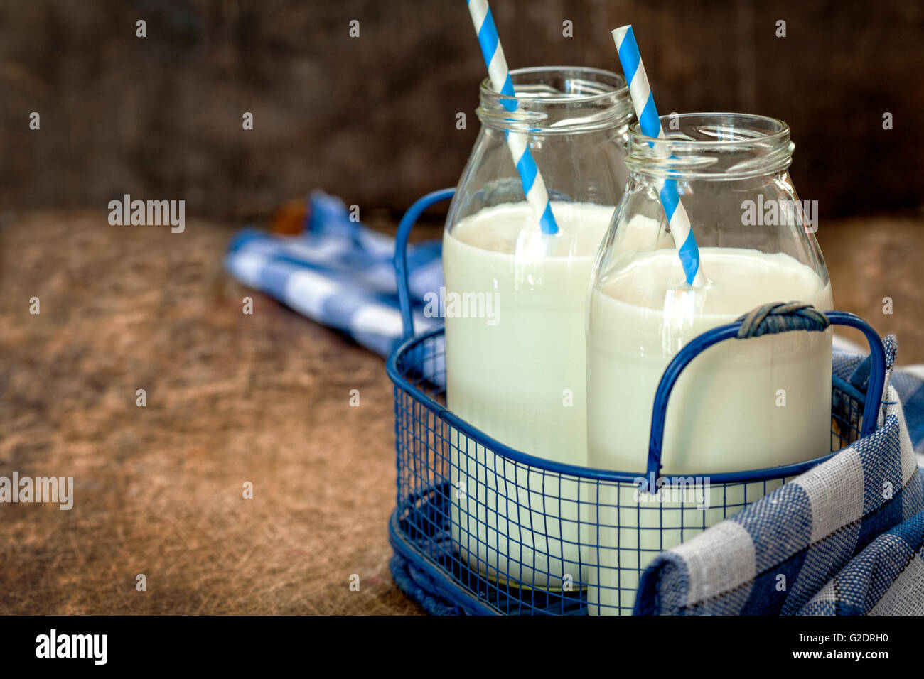 Milk bottles with straws Stock Photo - Alamy