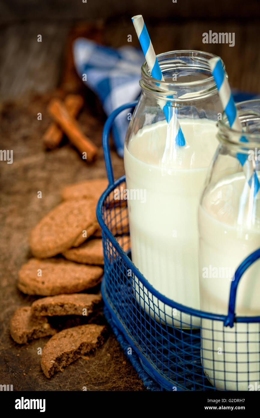 Milk bottles with straws Stock Photo - Alamy