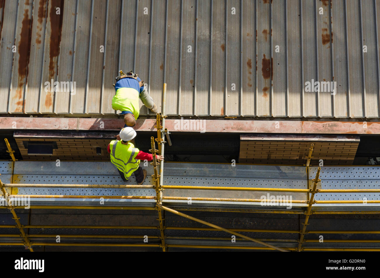 Looking down on men working in high visibility (hi-vis) apparel on the ...