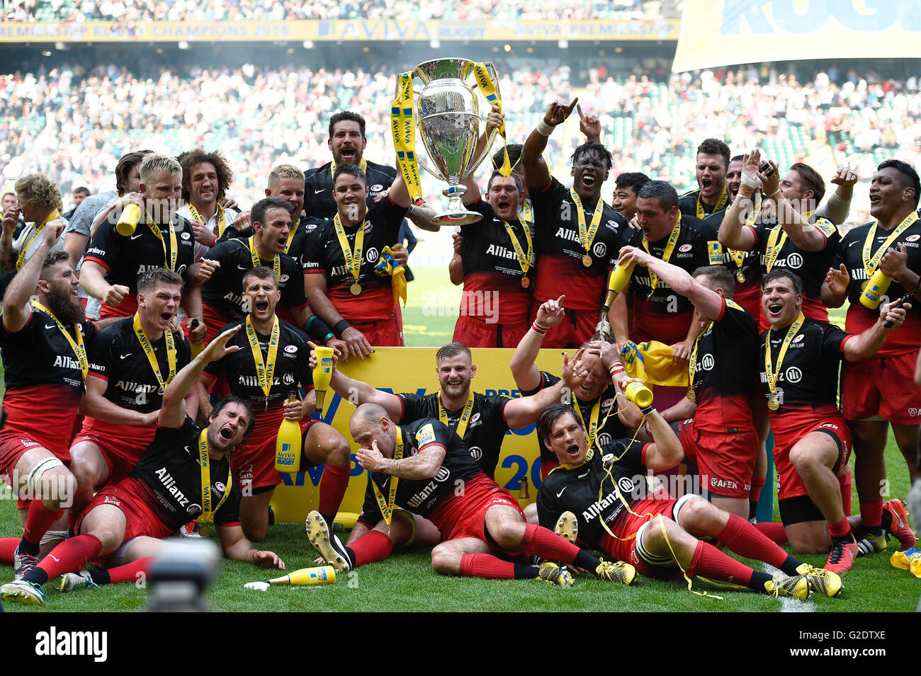 Saracens players celebrate with the Aviva Premiership trophy after ...