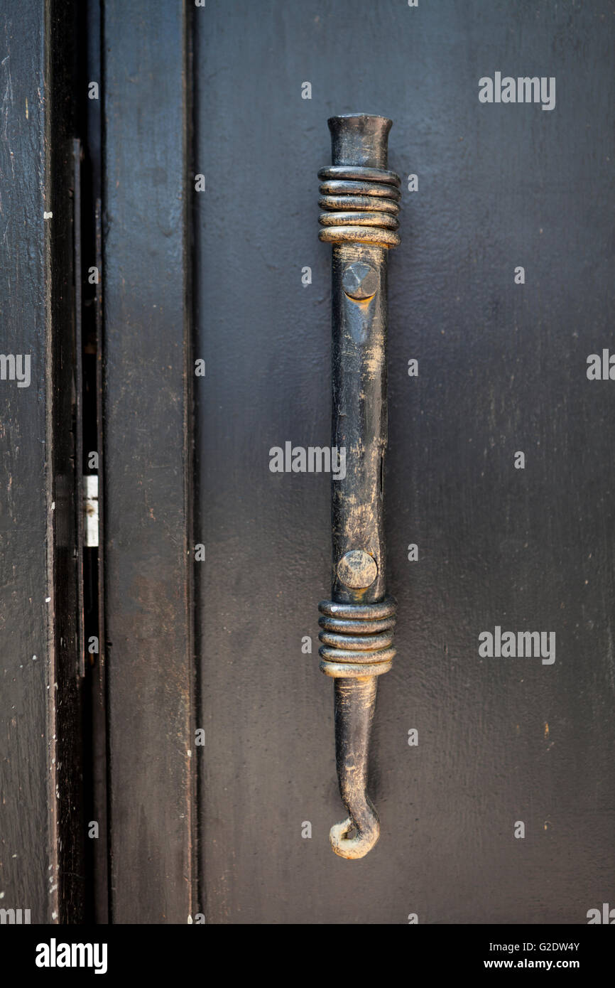 Brass Aged iron entrance gate handle Stock Photo - Alamy