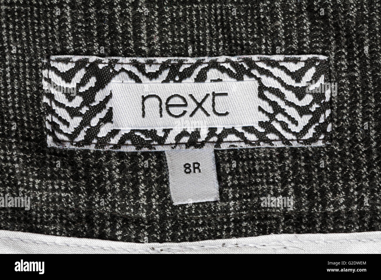 next label in size 8R trousers Stock Photo - Alamy