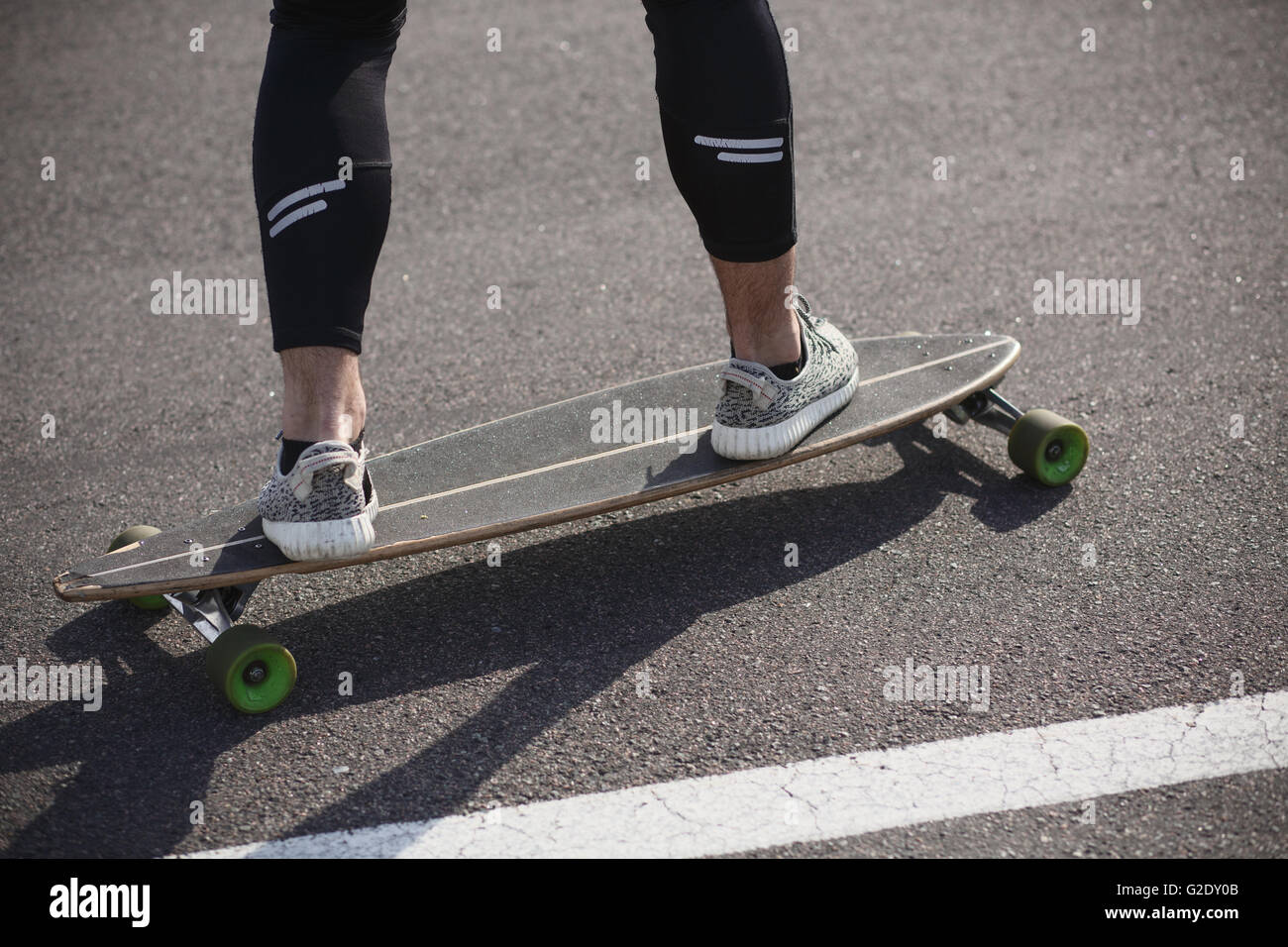 Man on skateboard or longboard Stock Photo - Alamy