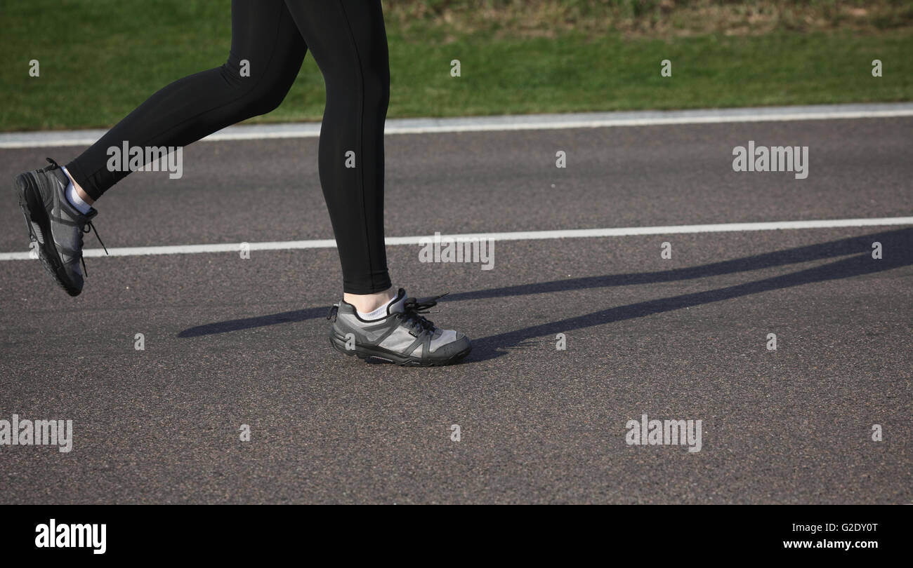 Jogging woman on track Stock Photo - Alamy