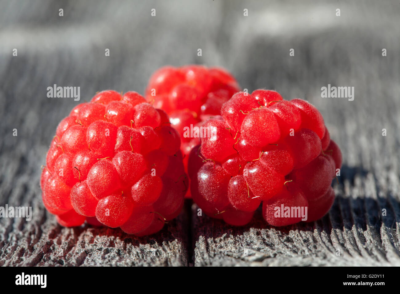 Sweet raspberry on wooden board, table. Texture, pattern in the wooden ...