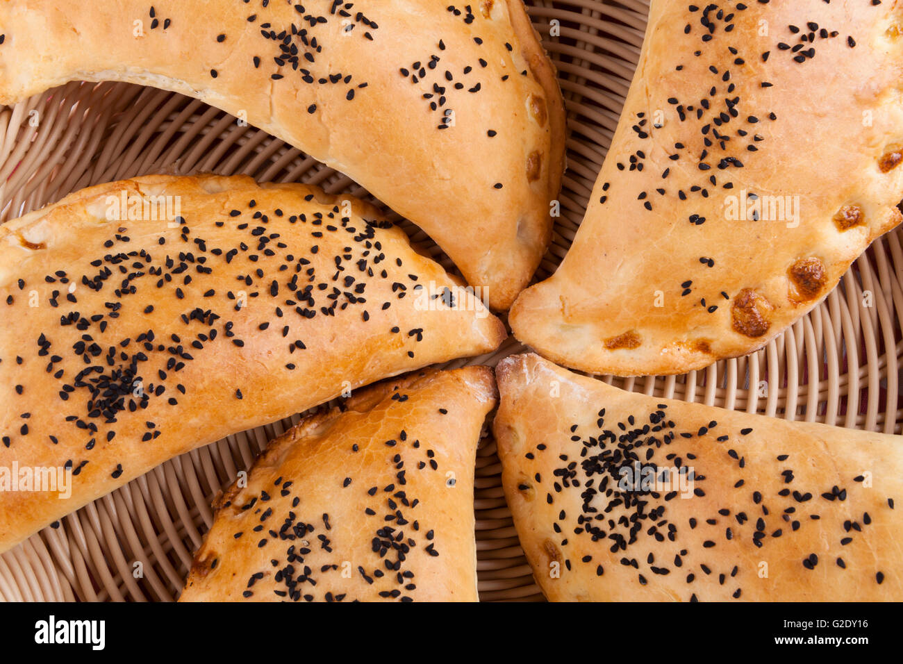 Filled pastry close-up in basket on round table Stock Photo - Alamy