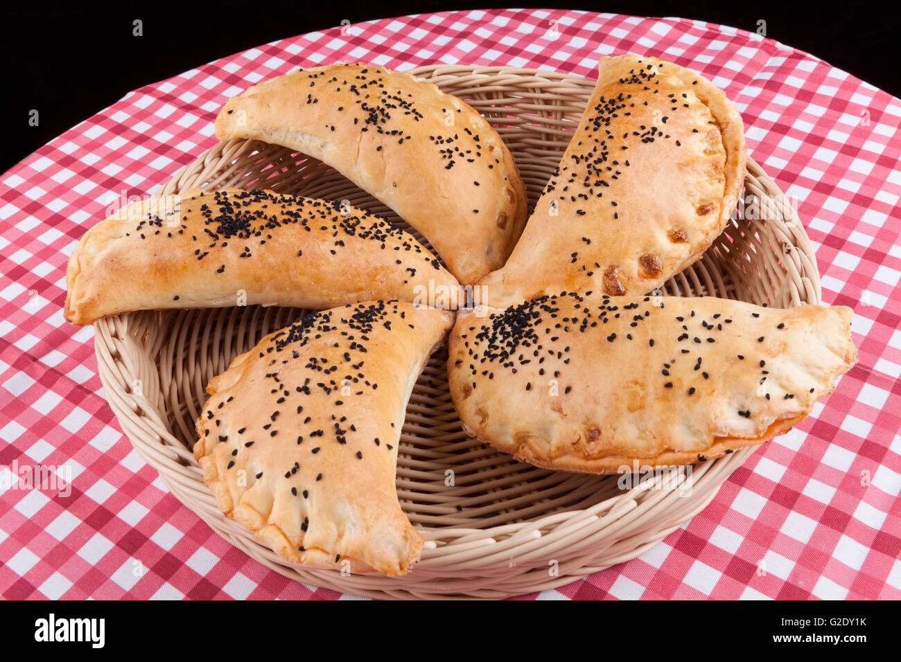 Filled pastry close-up in basket on round table Stock Photo - Alamy
