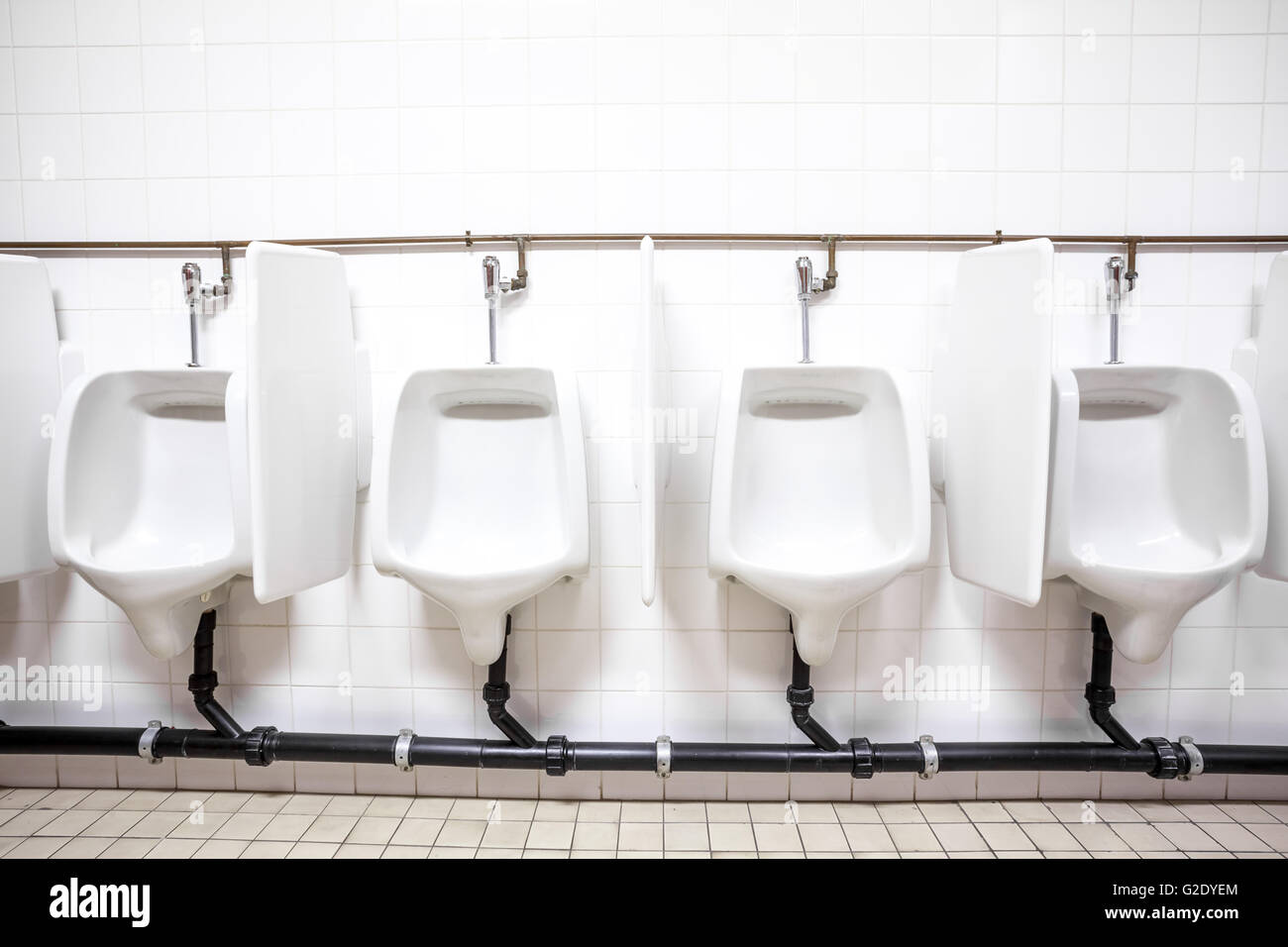 urinals in an old building for men only Stock Photo - Alamy