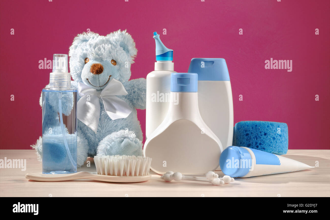 toiletries baby, blue items and pink background Stock Photo - Alamy