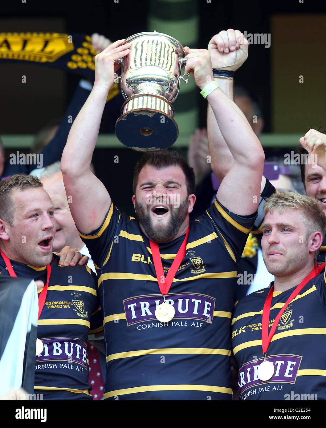 Cornwall's Kyle Marriott lifts the trophy following victory in the Bill ...