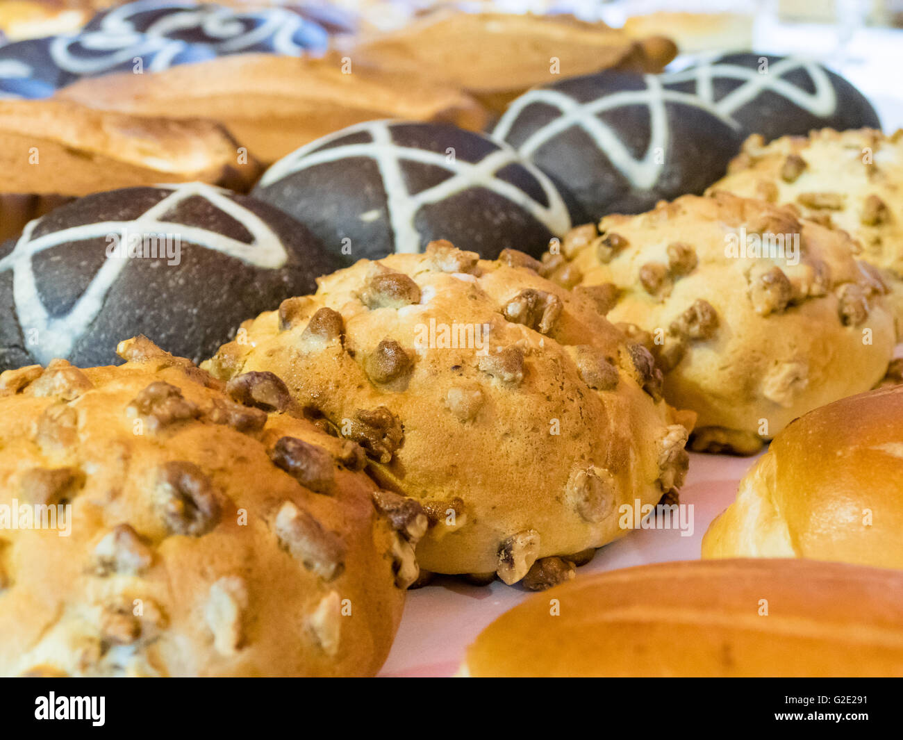 Variety of baked products on a bakery shelf Stock Photo - Alamy