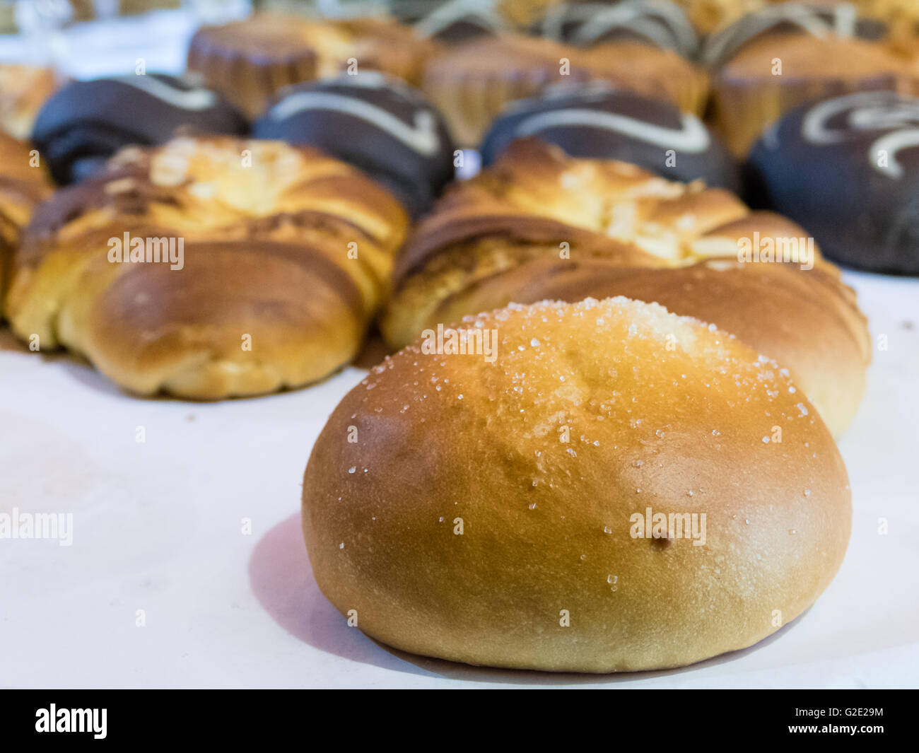 Variety of baked products on a bakery shelf Stock Photo - Alamy