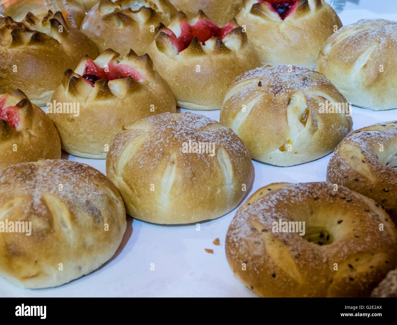 Variety of baked products on a bakery shelf Stock Photo - Alamy