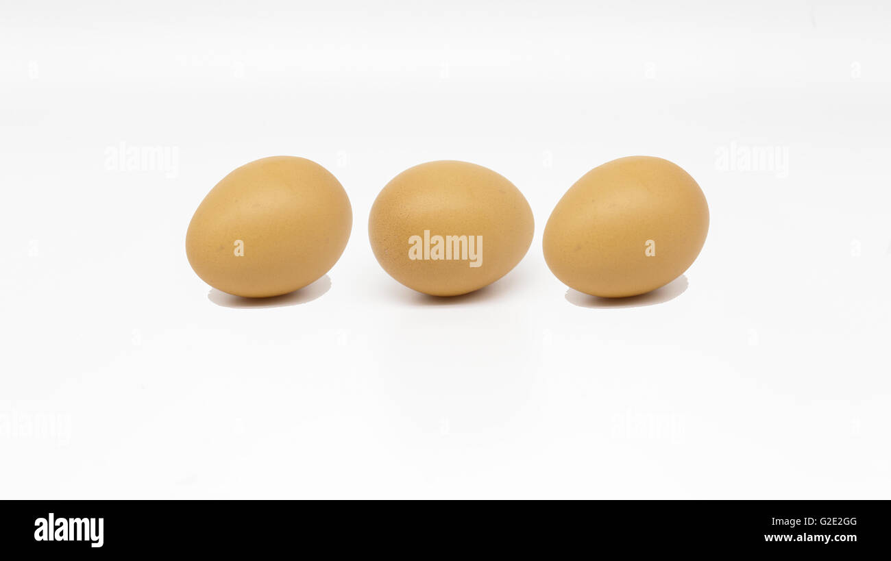Triple egg isolate on white background Stock Photo - Alamy
