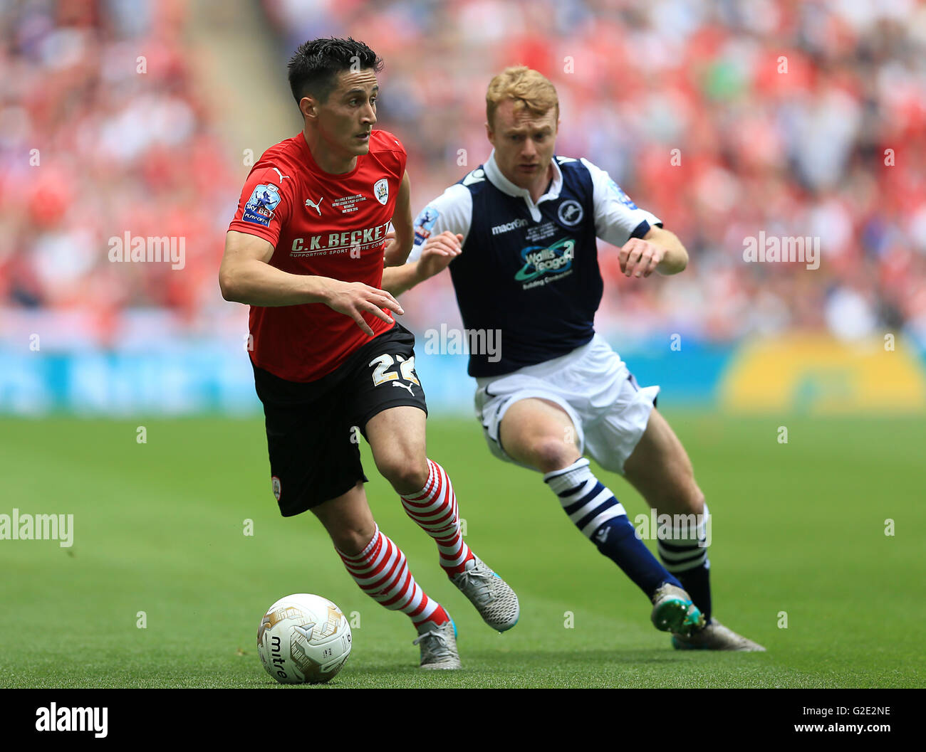 Barnsley's George Williams (left) and Millwall's Chris Taylor battle ...