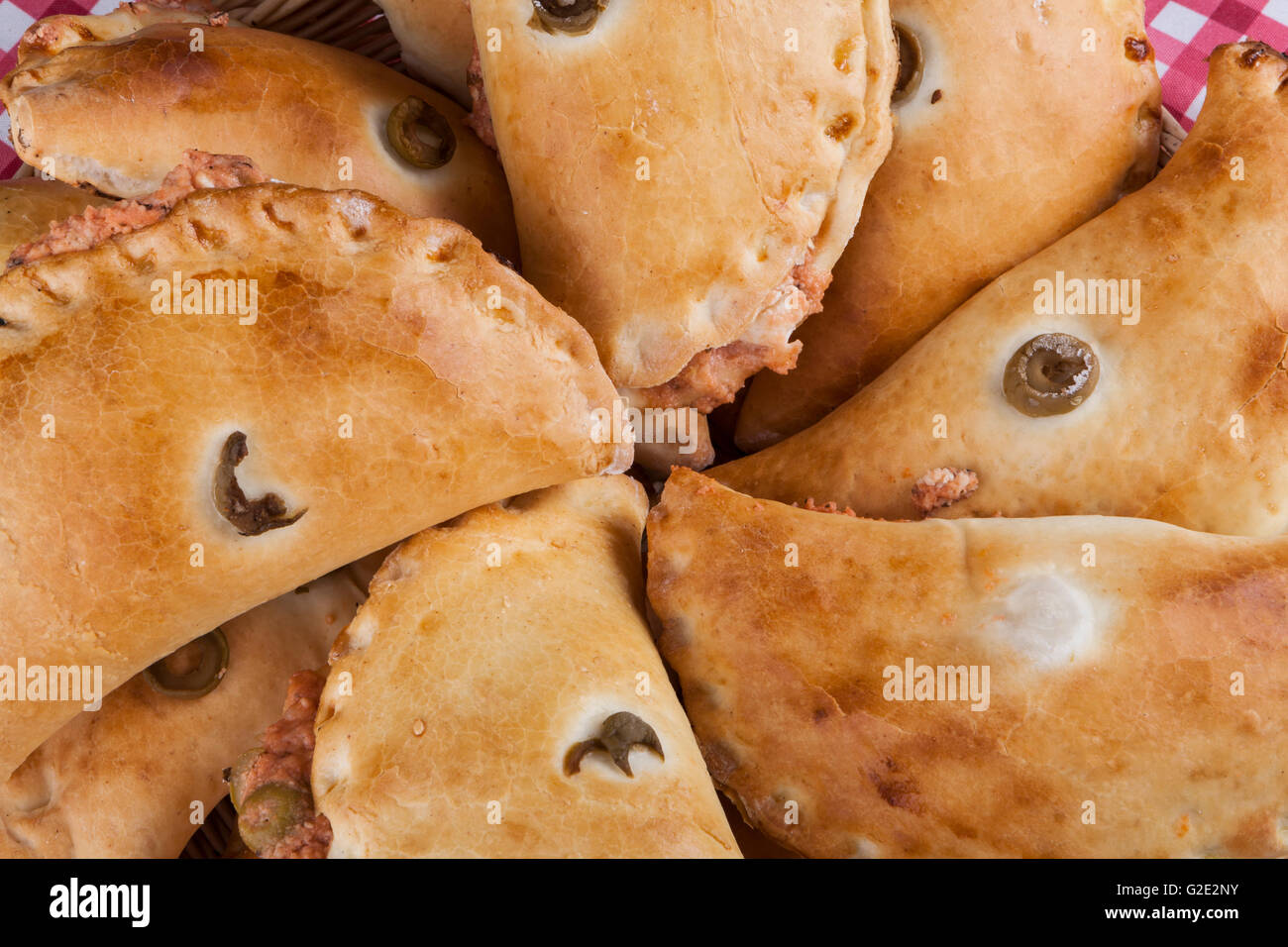 Filled pastry close-up in basket on round table Stock Photo - Alamy