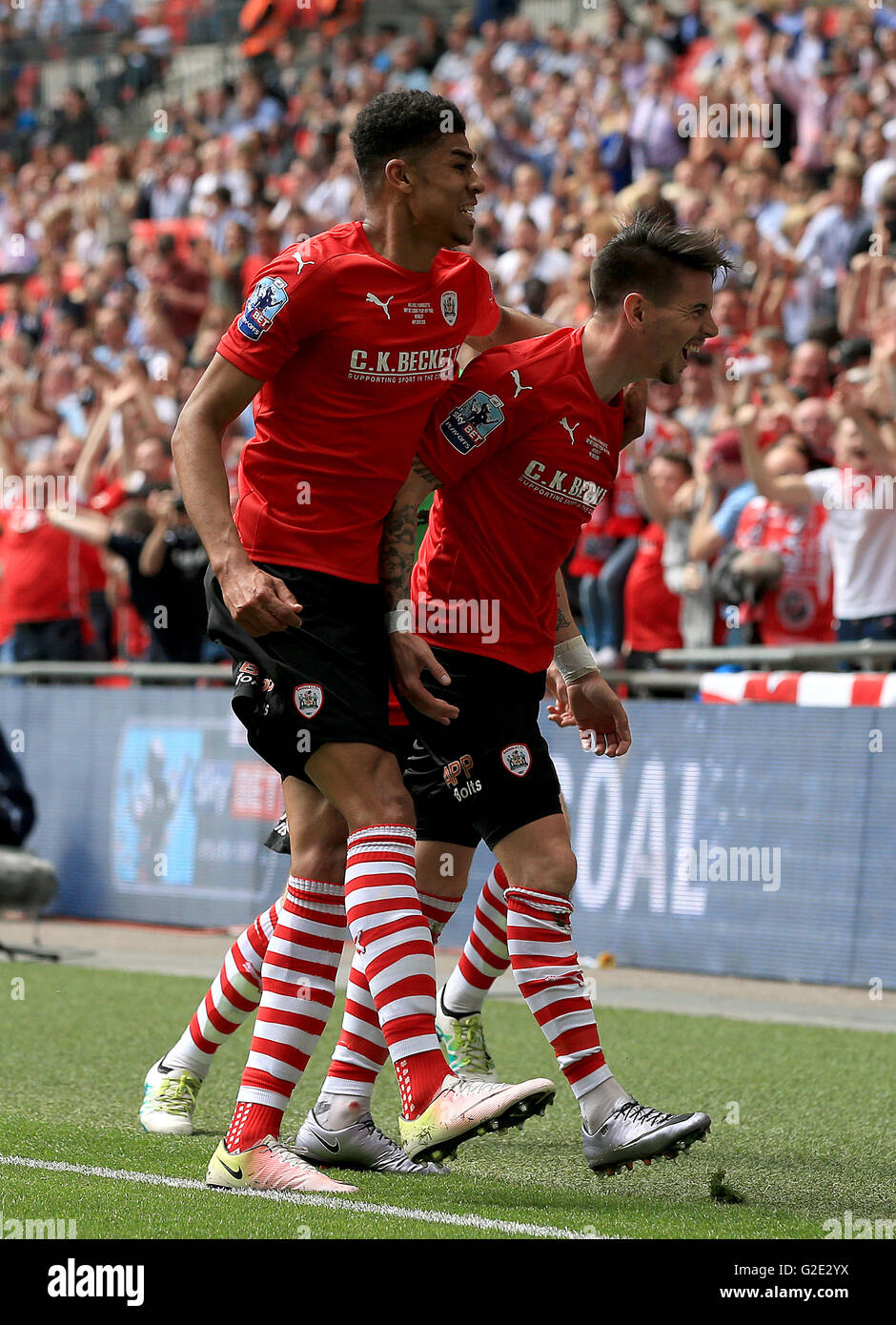 Barnsley's Adam Hammill (right) celebrates with team-mate Ashley ...
