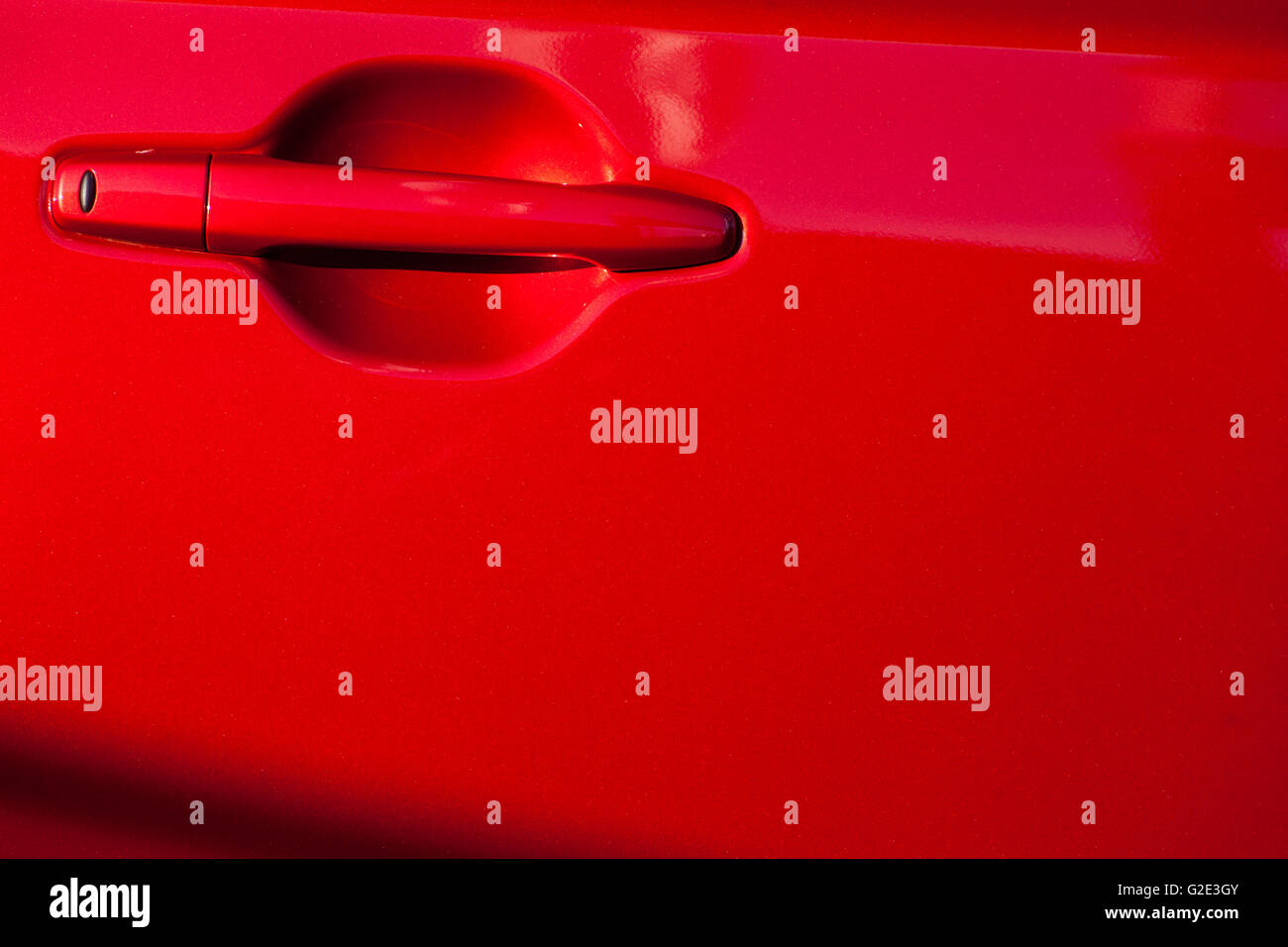 Color image of a red car door handle Stock Photo - Alamy