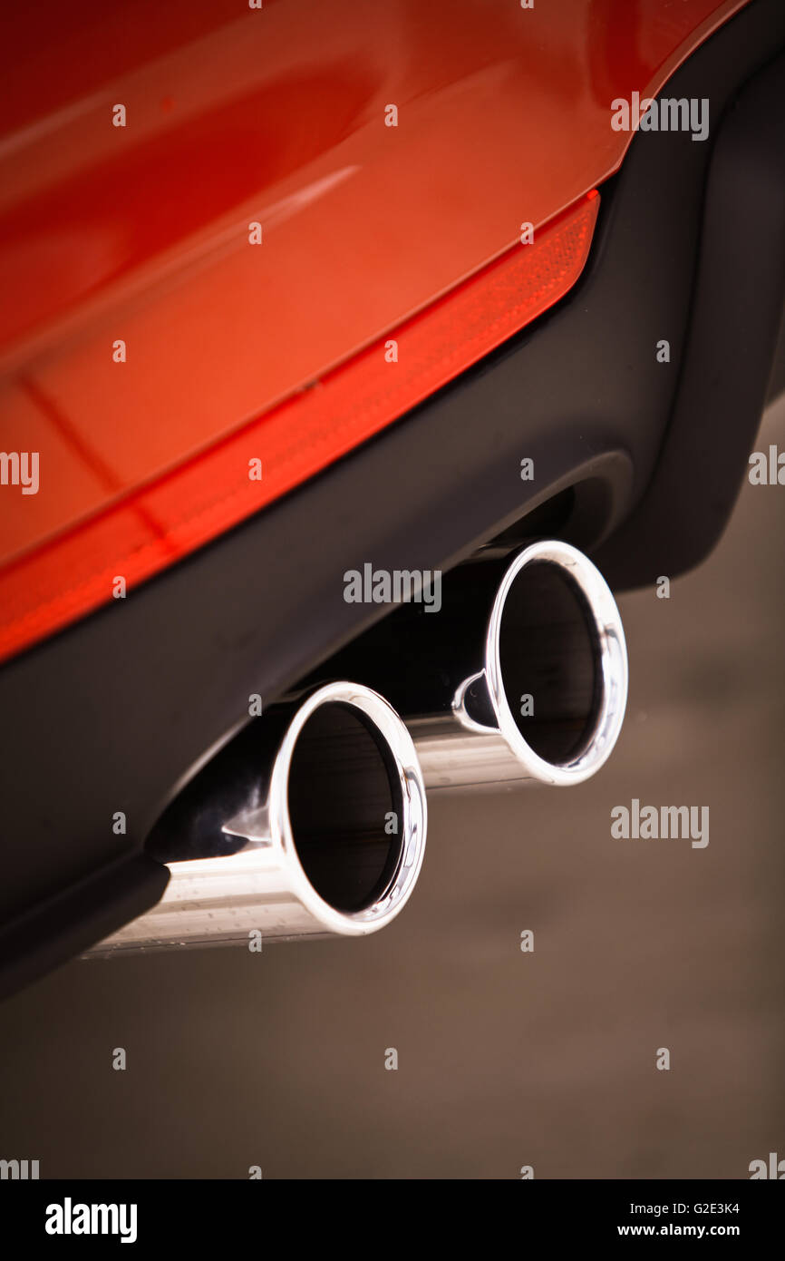 Detail of the double exhaust of a car Stock Photo - Alamy