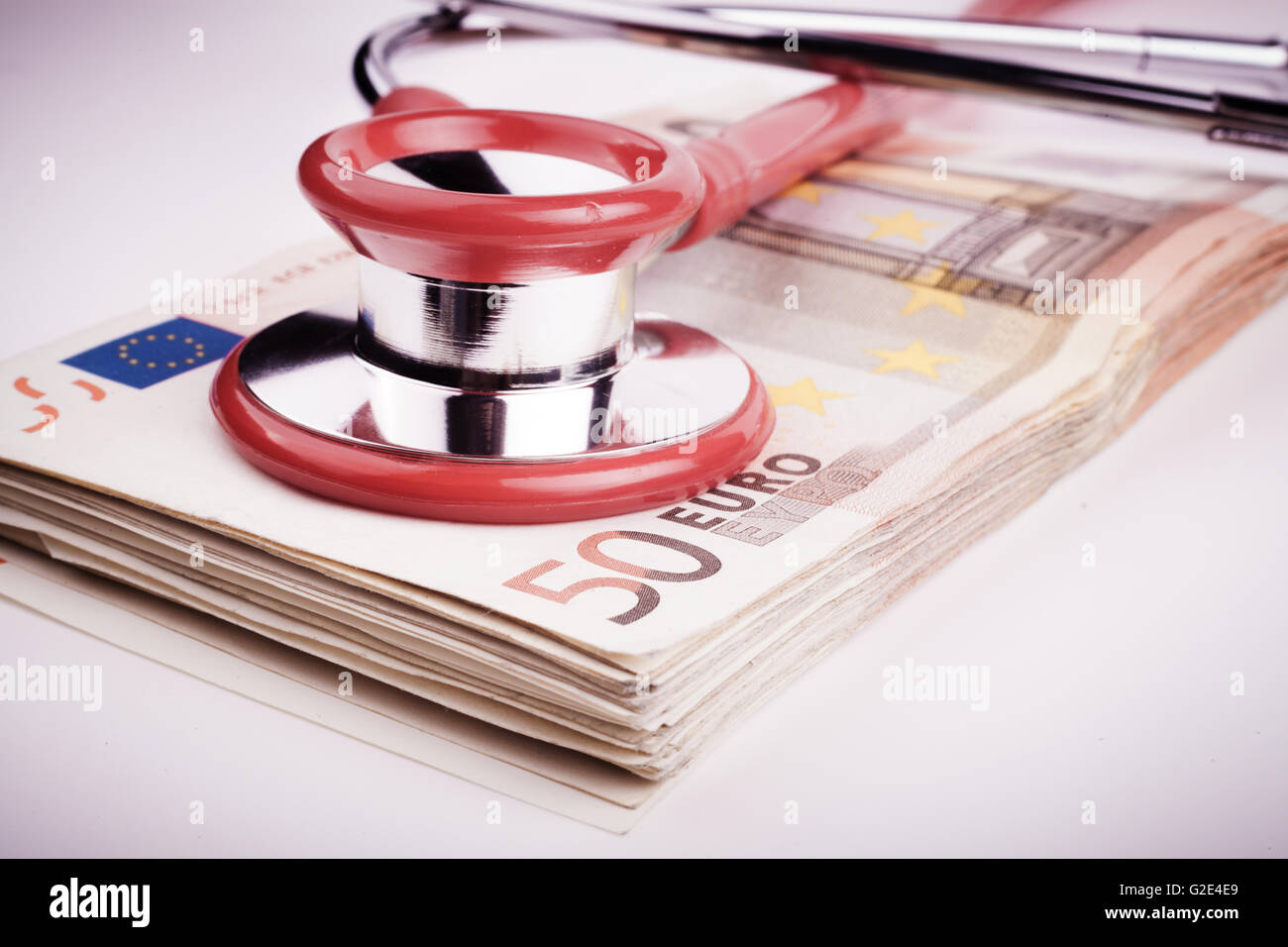 Euro banknote pile with red stethoscope inked style image Stock Photo ...