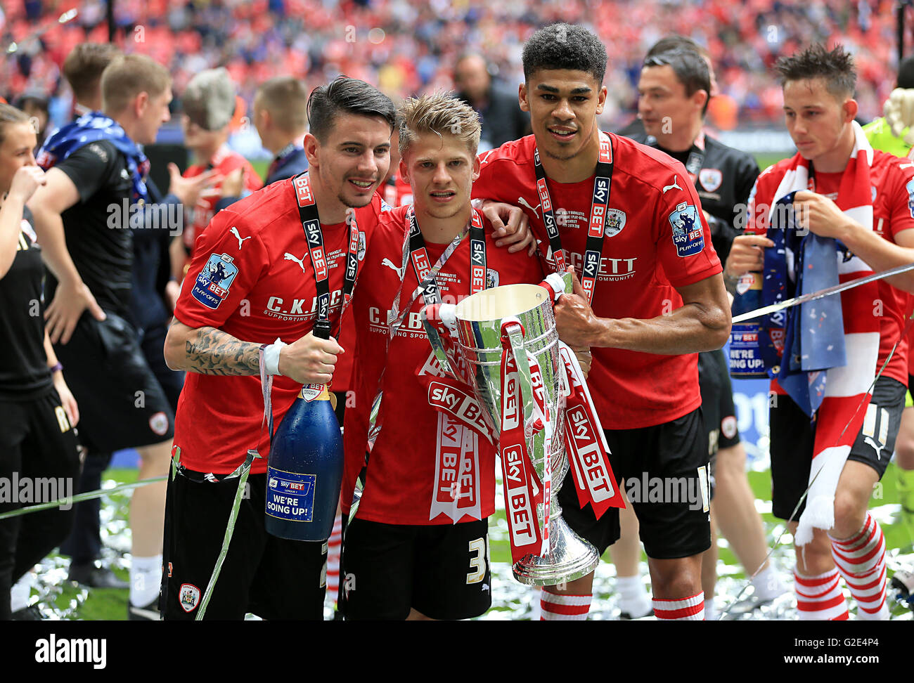 (left to right) Barnsley's Adam Hammill, Barnsley's Lloyd Isgrove and ...