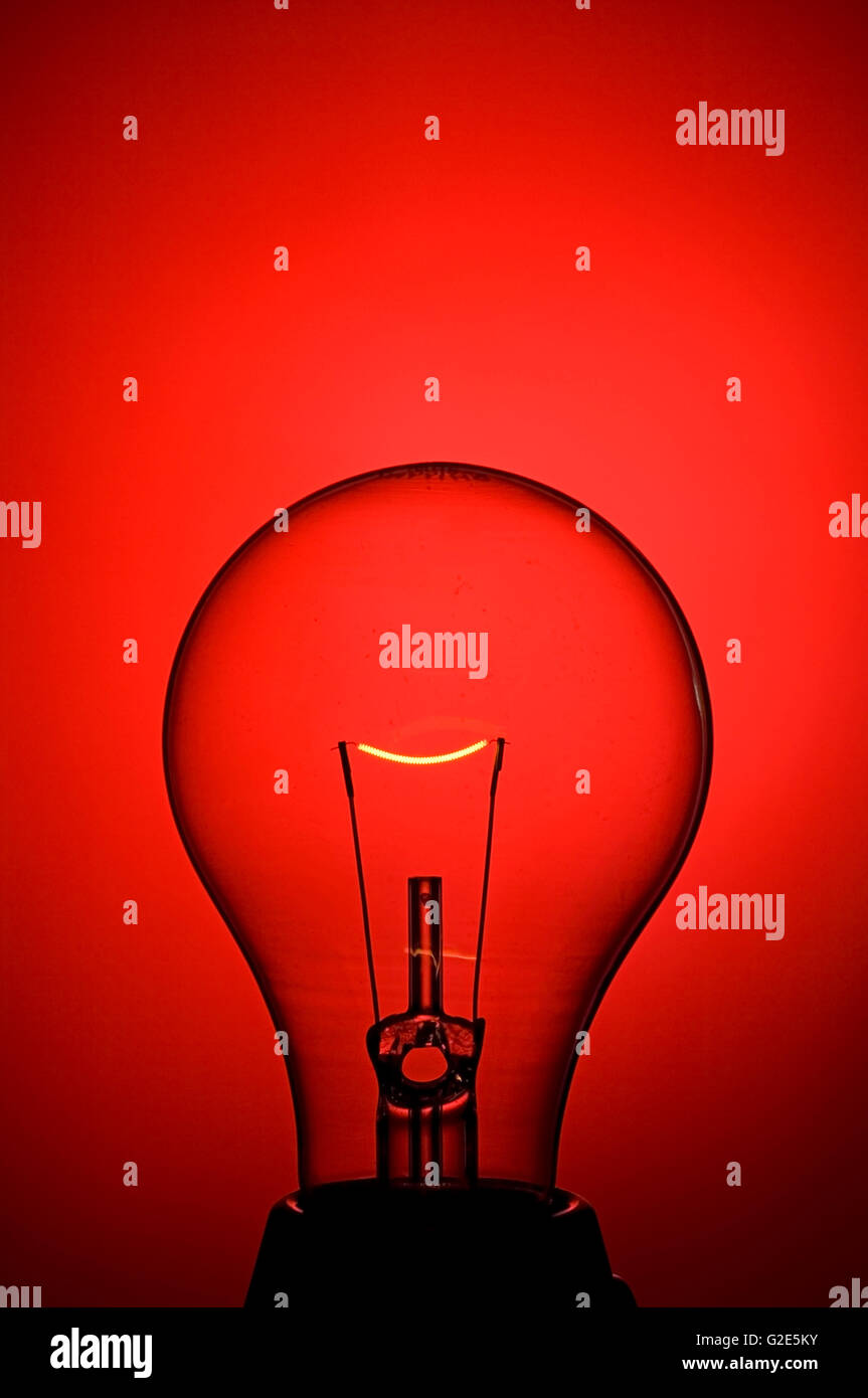 Light Bulb on Red Stock Photo - Alamy