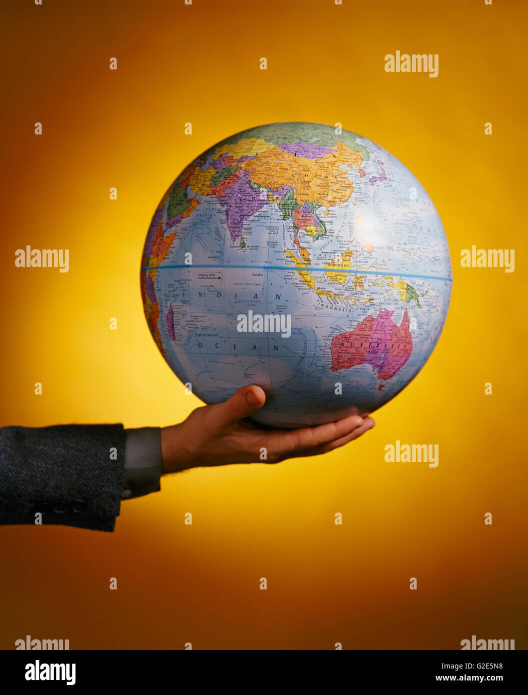Hand With Globe Stock Photo - Alamy