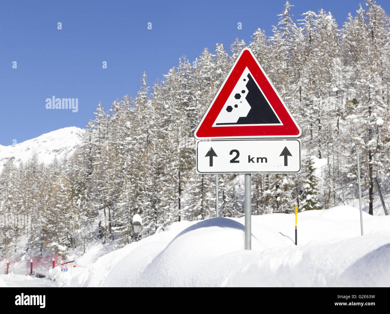 Danger road sign on a winter road Stock Photo - Alamy